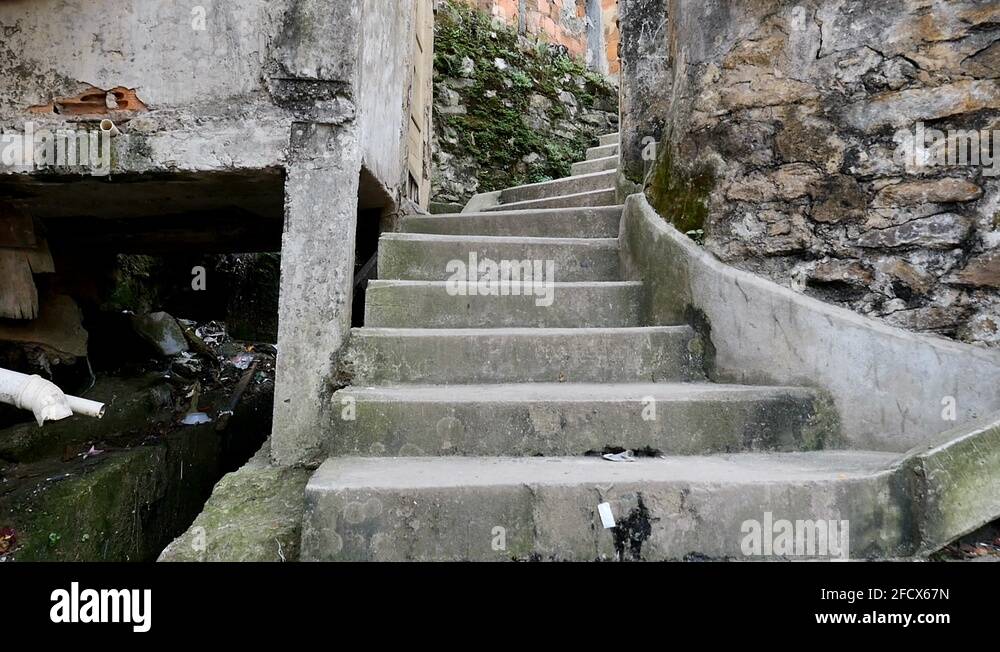 Tilt up narrow stairs in favela neighborhood Santa Marta, Rio De ...