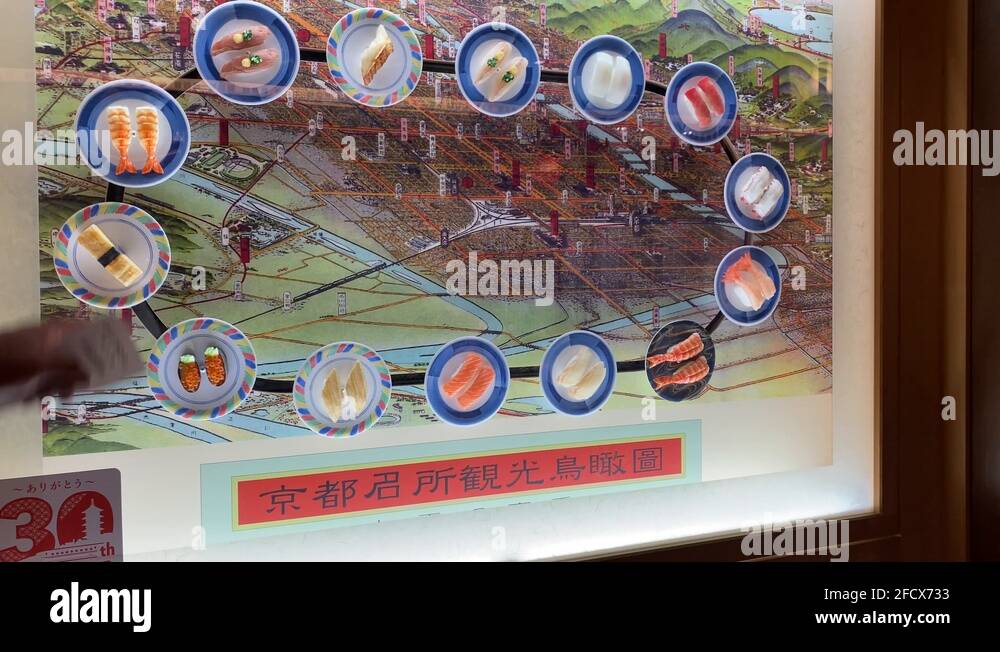 Carousel of sushi outside a conveyor belt sushi restaurant in Tokyo ...