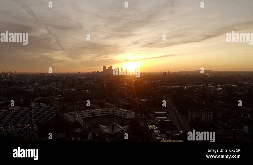 Video shows London's sunrise landscape. The sun ray shines through the ...