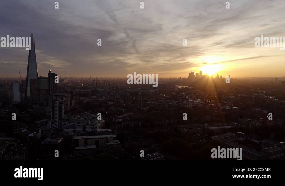 Video shows London's sunrise landscape. The sun ray shines through the ...