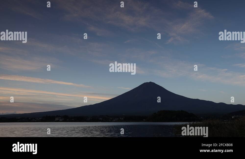 Big sky sunrise timelapse across the lake in front of Mount Fuji in ...