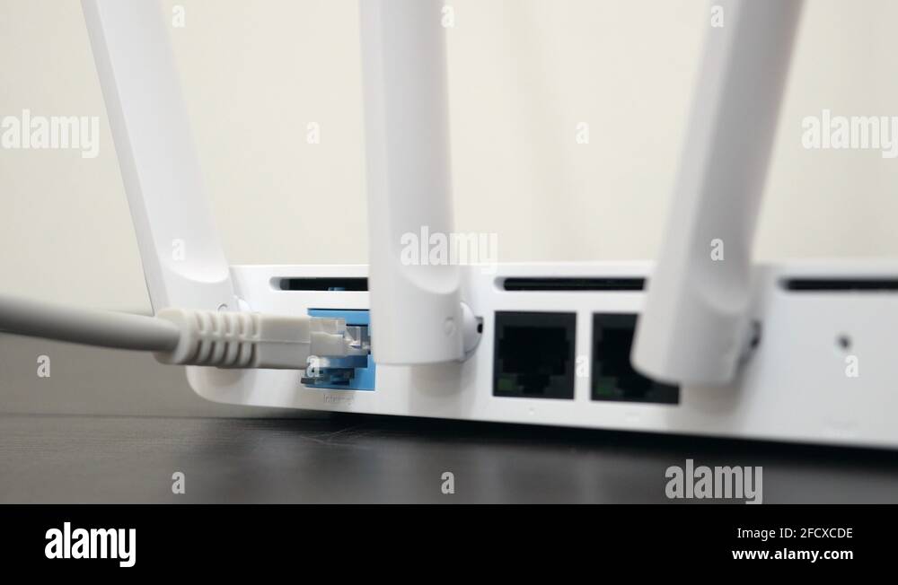 Elderly Man Hand Unplugging White Internet Cable From Wireless Router ...