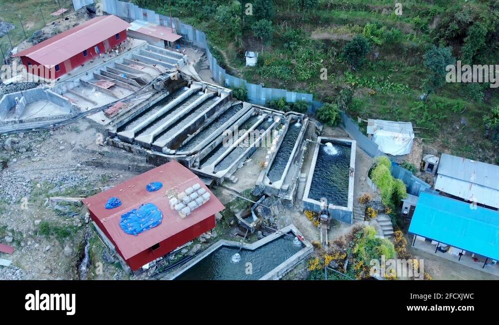 Fish farm in rural mountain region of Nepal. Aerial view of Cat fish ...