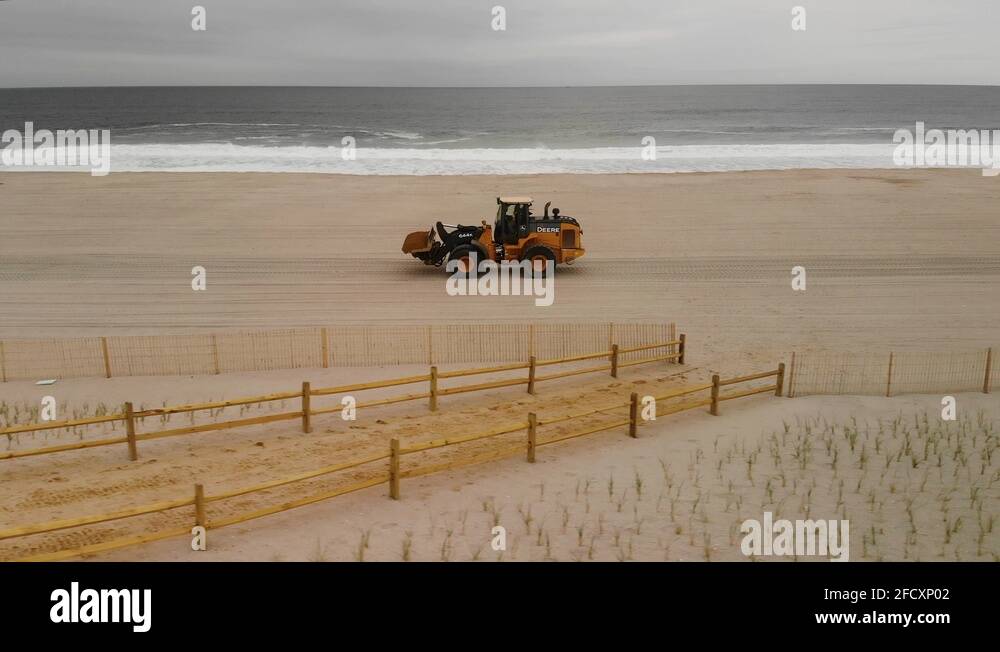 Bucket loader beach Stock Videos & Footage - HD and 4K Video Clips - Alamy
