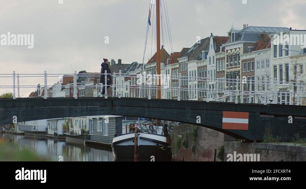 Reflections of a bridge and houses in the canal Stock Videos & Footage ...