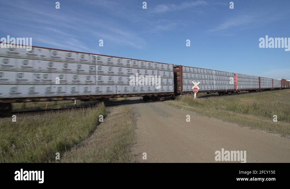 railroad, freight train rural gravel level crossing, bulkhead flatbed ...