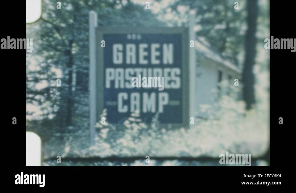 1940s: UNITED STATES: Green Pastures Camp sign. Path through trees in ...