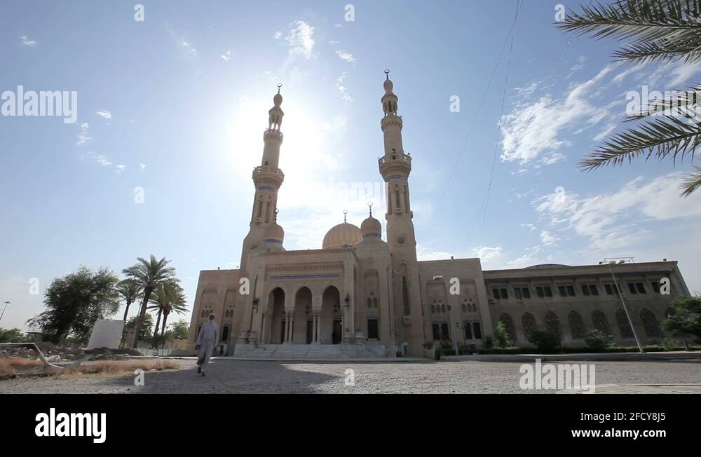 Muslim prayer walks in front of Ibn Taymiyyah Mosque in Baghdad, Iraq ...
