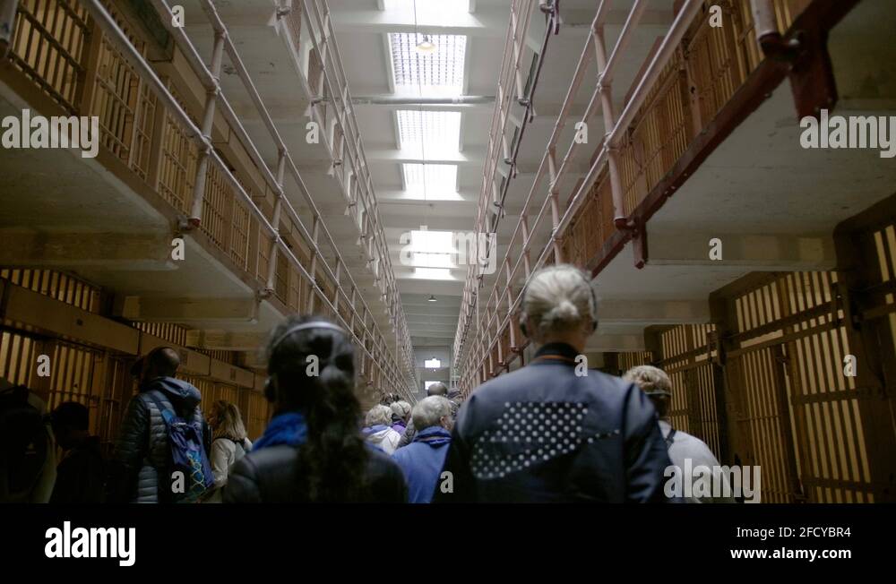 Walking forward through the aisle of prison cells inside the prison of ...