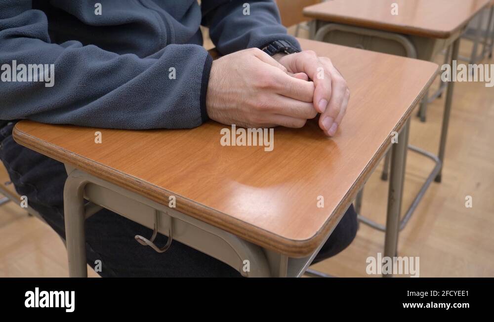 Stressed Hands Of a Student at His Desk in a Classroom Stock Video ...
