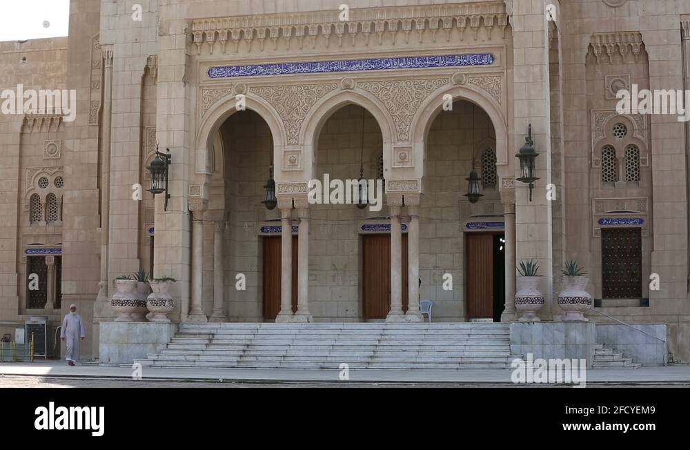 Muslim prayer walks in front of Ibn Taymiyyah Mosque in Baghdad, Iraq ...