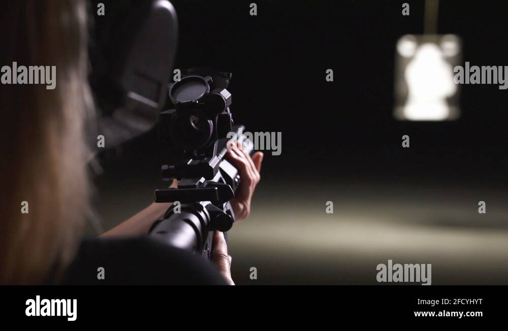 Woman aiming gun Stock Videos & Footage - HD and 4K Video Clips - Alamy