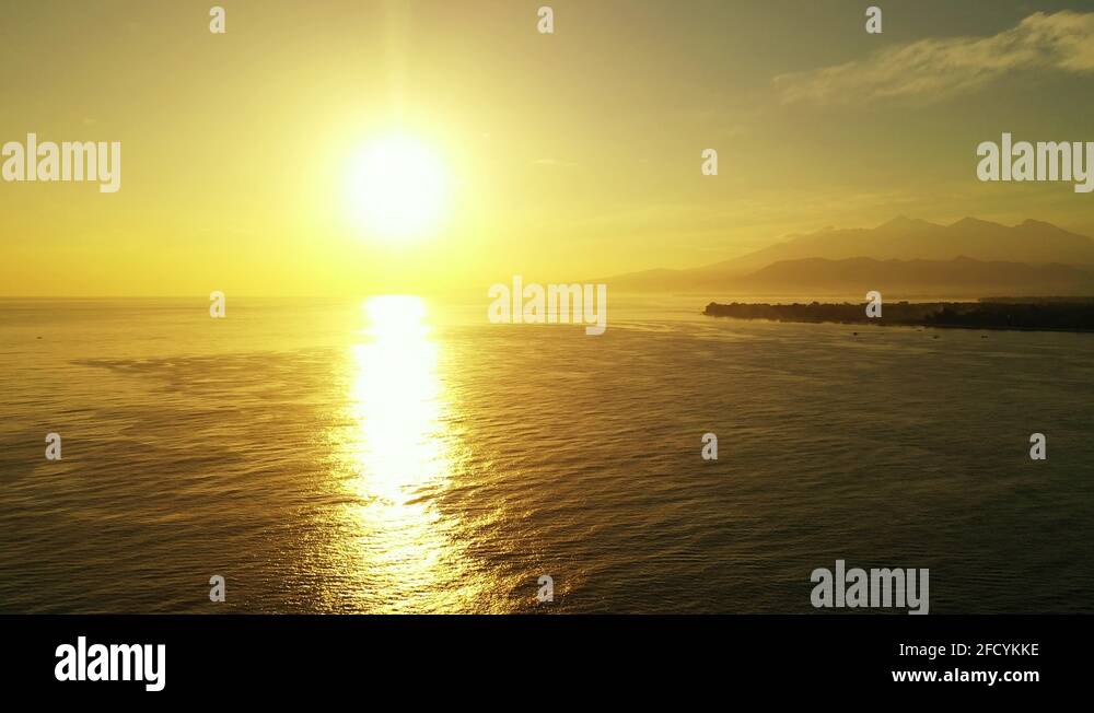 The Beautiful Setting Sun Over The Calm Waters Of The Bahamas With ...