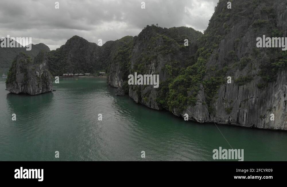 Ha Long Bay, Vietnam. Drone shot landing on a beach in Ha Long Bay ...