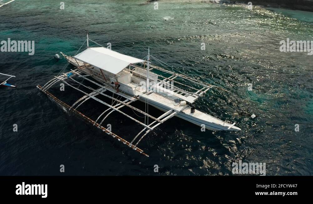 Paraw Traditional Filipino Boat With Outriggers Anchored in Sea ...