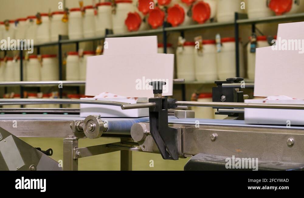 Folding white food boxes on a conveyor in a factory Stock Video Footage ...