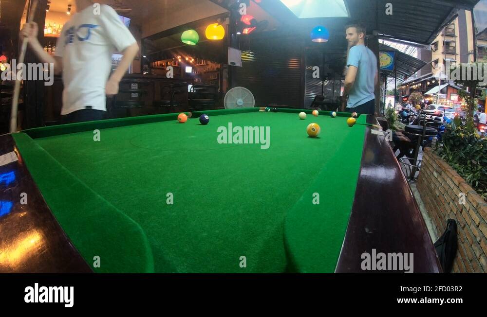 Timelapse of Two Young Guys Playing Pool in a Asian Bar during ...