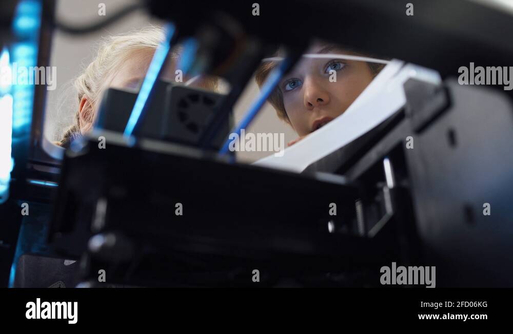 Education in the modern school, children learn modeling, boy and girl ...