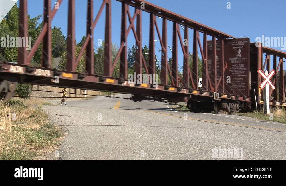 railroad, branch-line railroad freight train at level crossing Stock ...