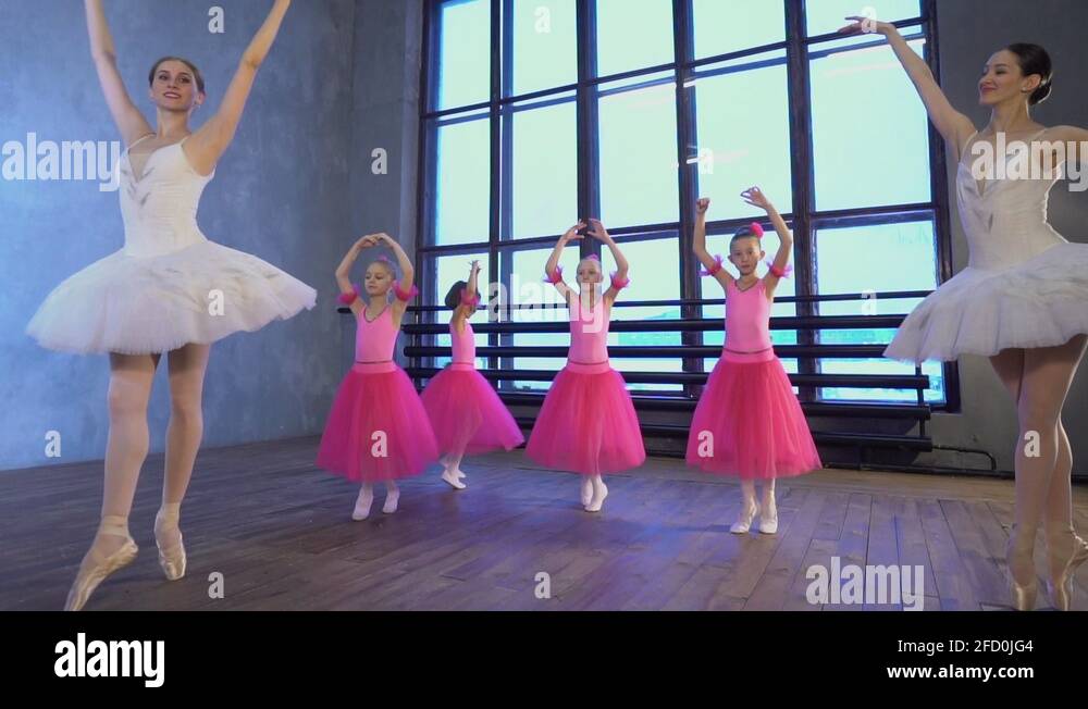 Little girls dance ballet. Children in ballet class. Little ballerinas ...