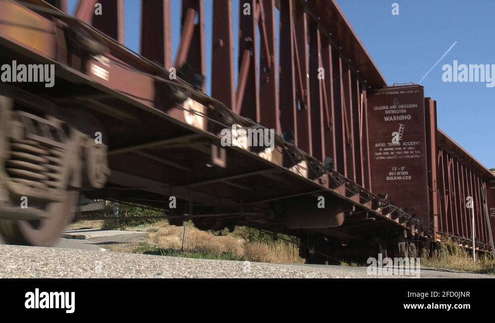 railroad, branch-line railroad freight train low angle, bulkhead and ...