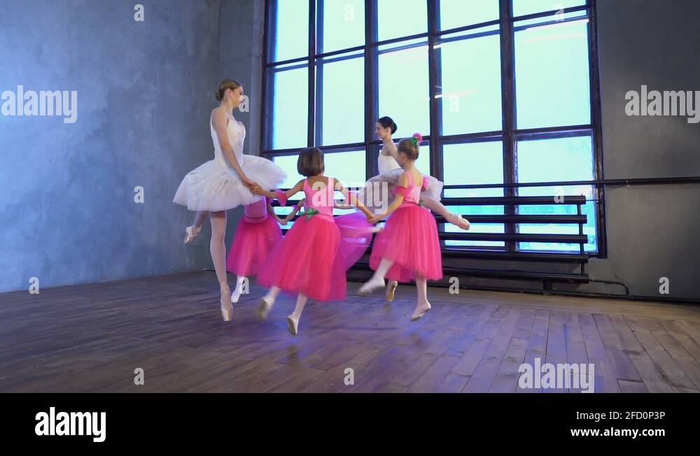Little girls dance ballet. Children in ballet class. Little ballerinas ...