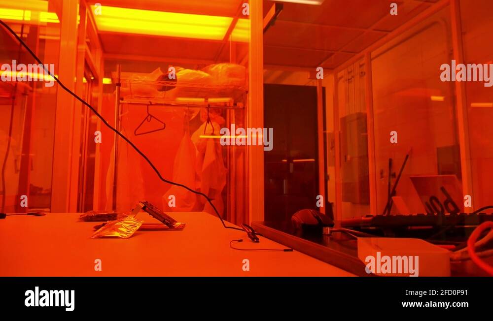 A student walks into a clean room to design an experiment in a clean ...