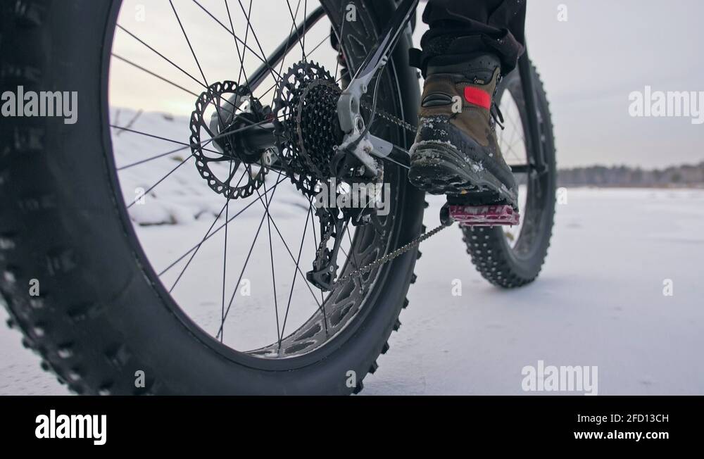 Professional extreme sportsman biker riding fat bike in outdoor ...