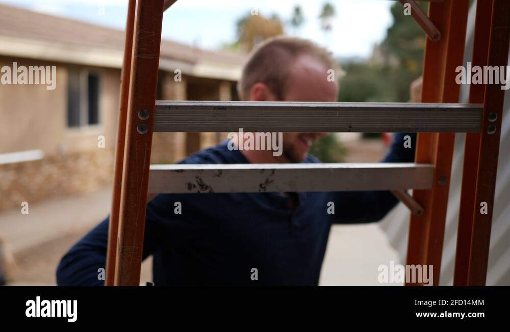 Carrying a ladder Stock Videos & Footage - HD and 4K Video Clips - Alamy