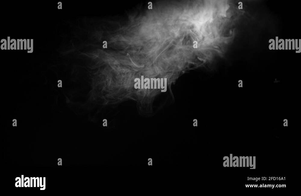 Atmospheric smoke, fog, haze effect in slow motion on black background ...