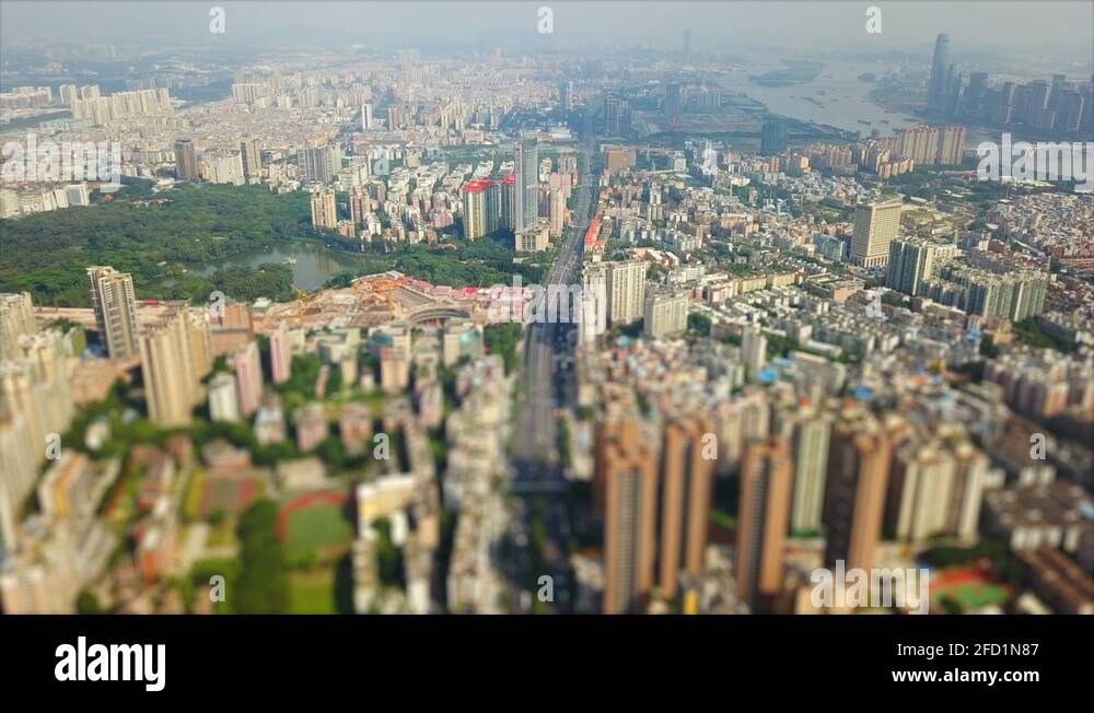 sunny day guangzhou cityscape aerial high fly panorama 4k tilt shift ...