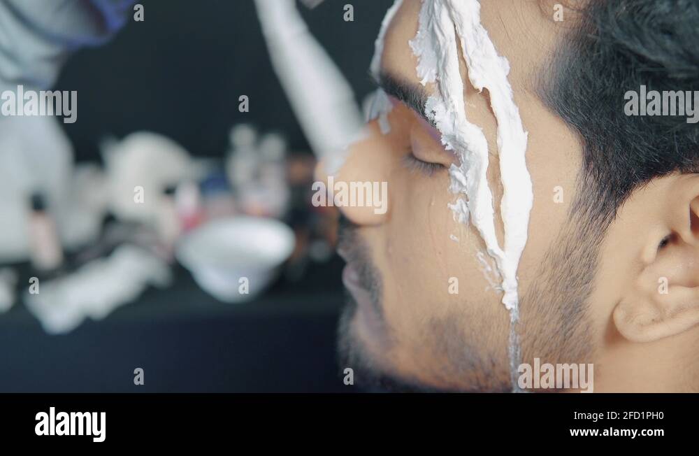 Process of making Halloween mask by putting white prosthetic insert on ...