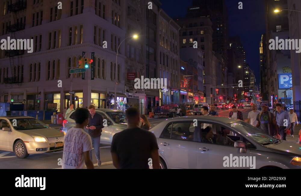 Busy New York City intersection street traffic, cars and pedestrians ...