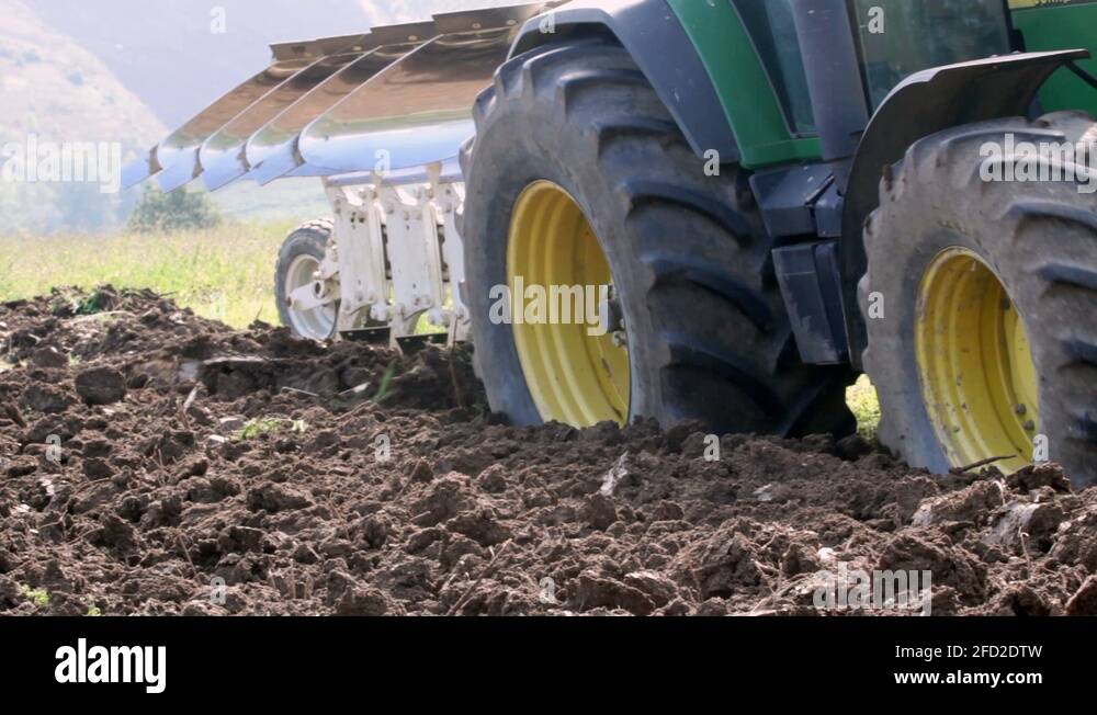 Primary tillage of soil Stock Video Footage - Alamy