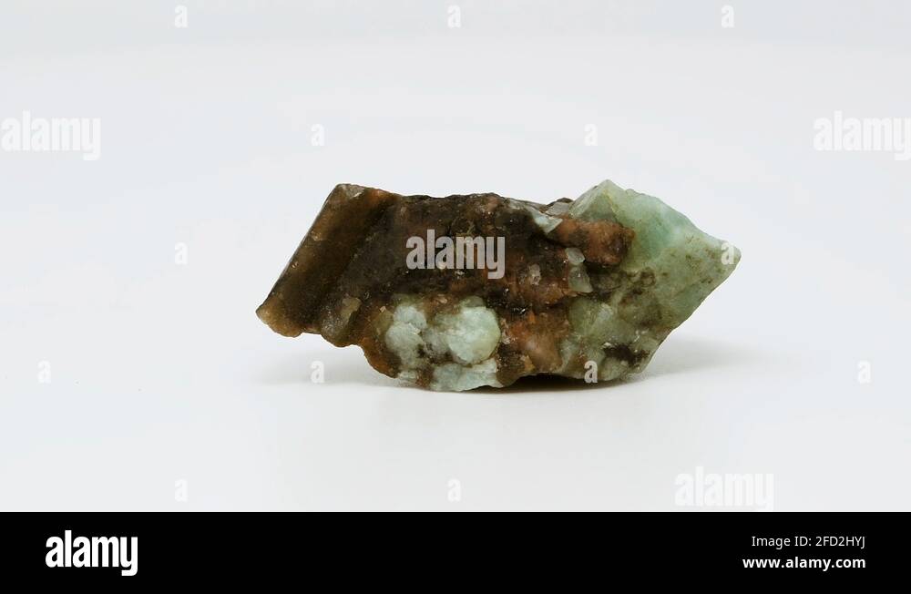 Very close view of raw, low grade emerald mineral. Rotating back to ...