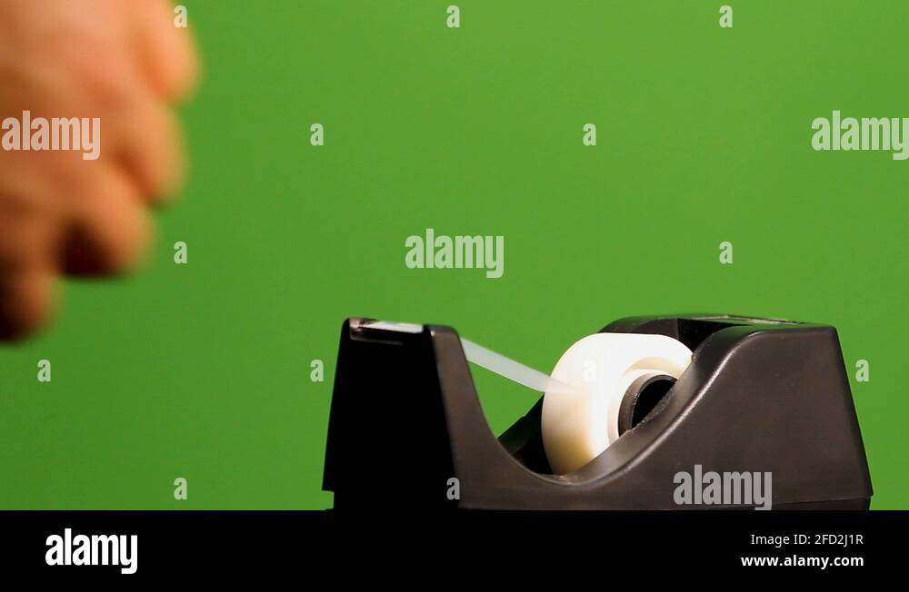 Tape dispenser, dispensing a piece of tape, on green screen Stock Video ...