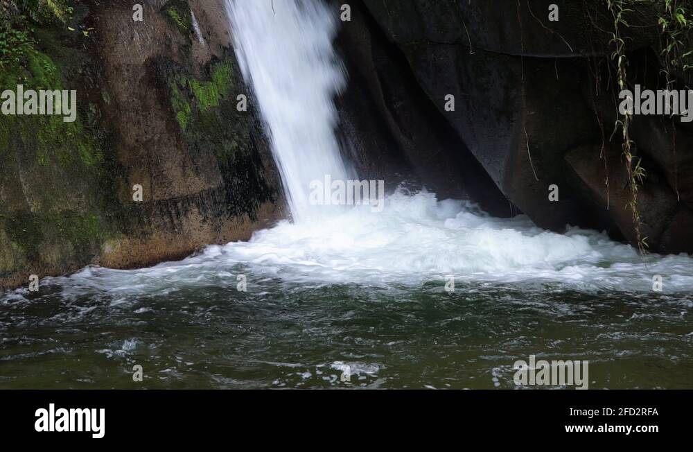 Strong water current at bottom of Taman Eden waterfall Stock Video ...