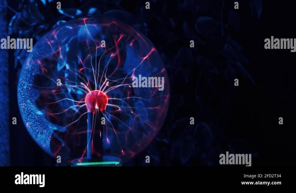 Plasma ball in action.Plasma ball lamp, Tesla Coil experiment with ...