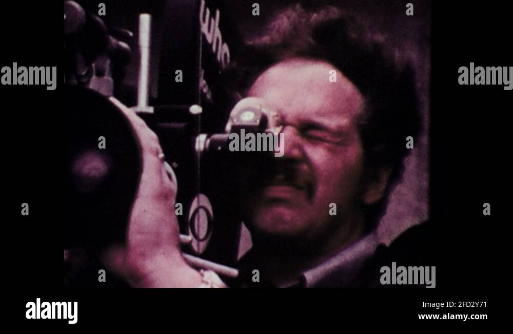 1970s: UNITED STATES: camera man films tornado in suburbs and city. Man ...