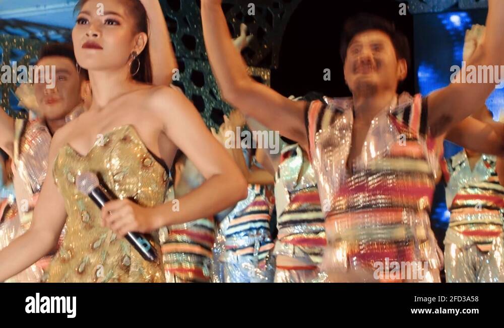 Performers on stage with female asian singer leader Stock Video Footage ...
