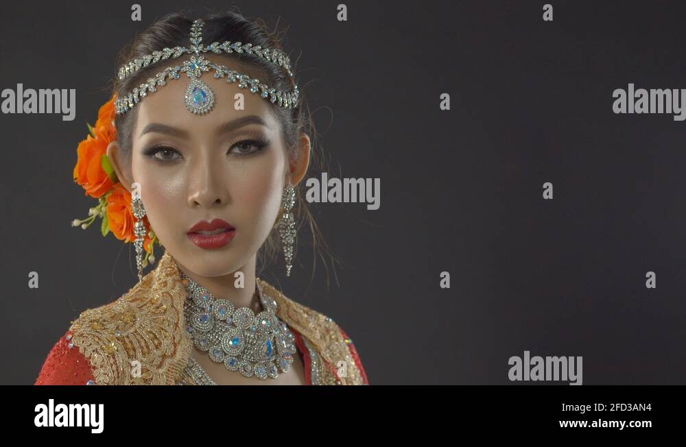 Stunning Indian bride in traditional dress smiles and poses for her ...