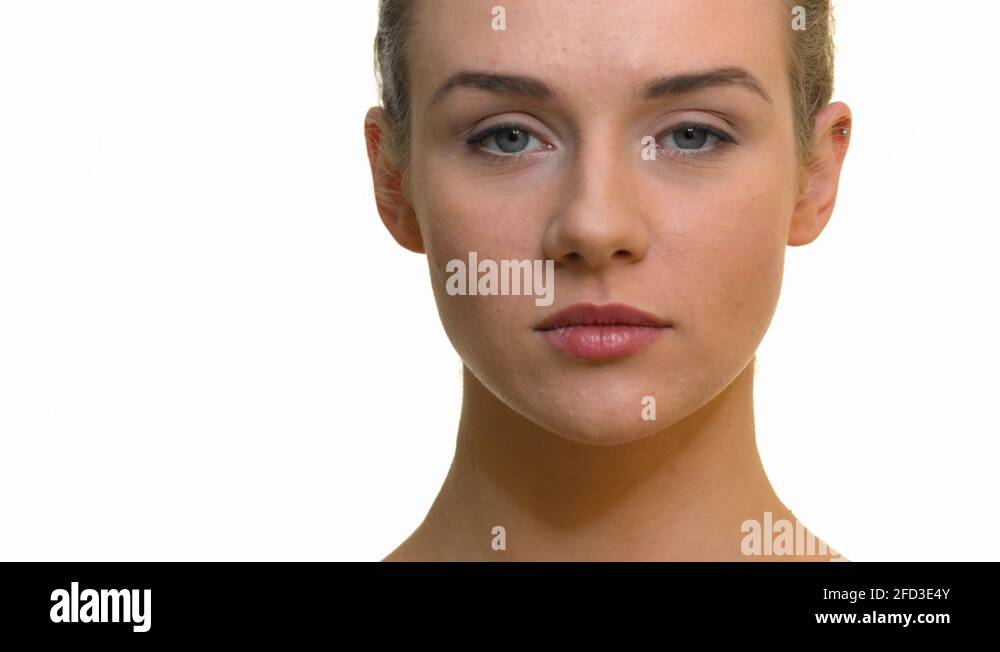A close-up of a woman's face with a neutral expression Stock Video ...