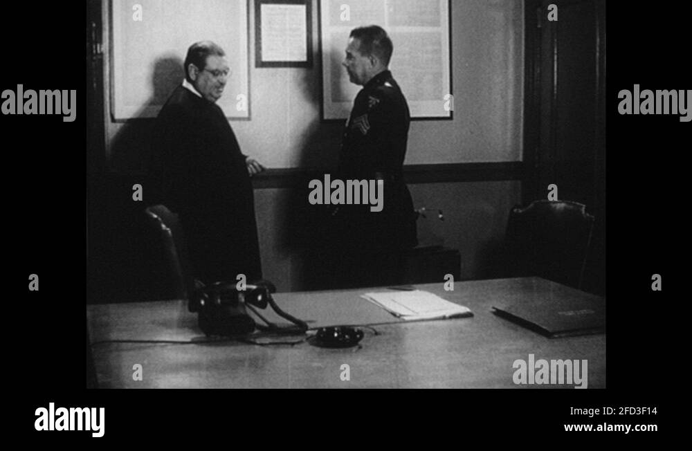 1960s: Office. Judge and police officer sit and speak Stock Video ...