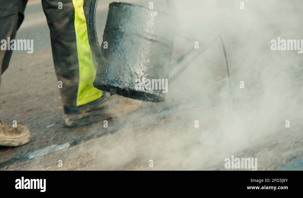 Pouring tar on road Stock Videos & Footage - HD and 4K Video Clips - Alamy