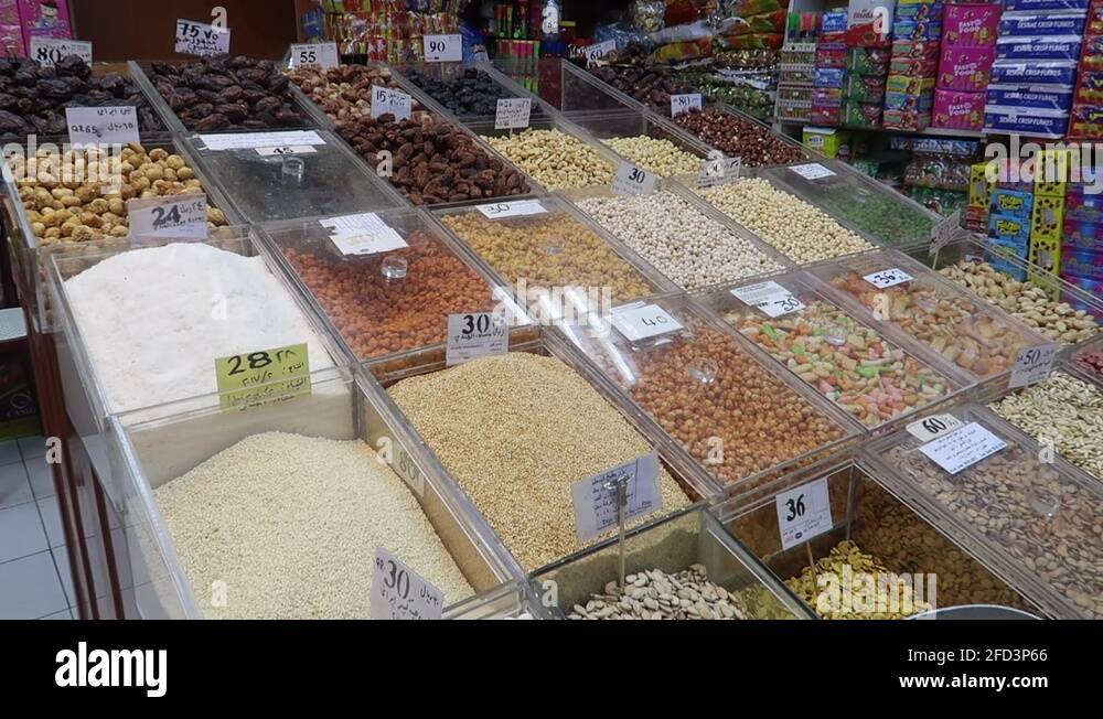 Panning view of local Doha Qatar vendors selection of nuts, seeds, and ...