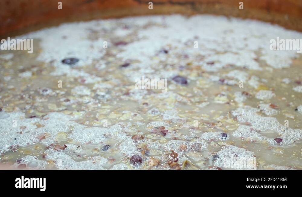 Traditional distillation of rakia (fermented fruit mixed with water and ...