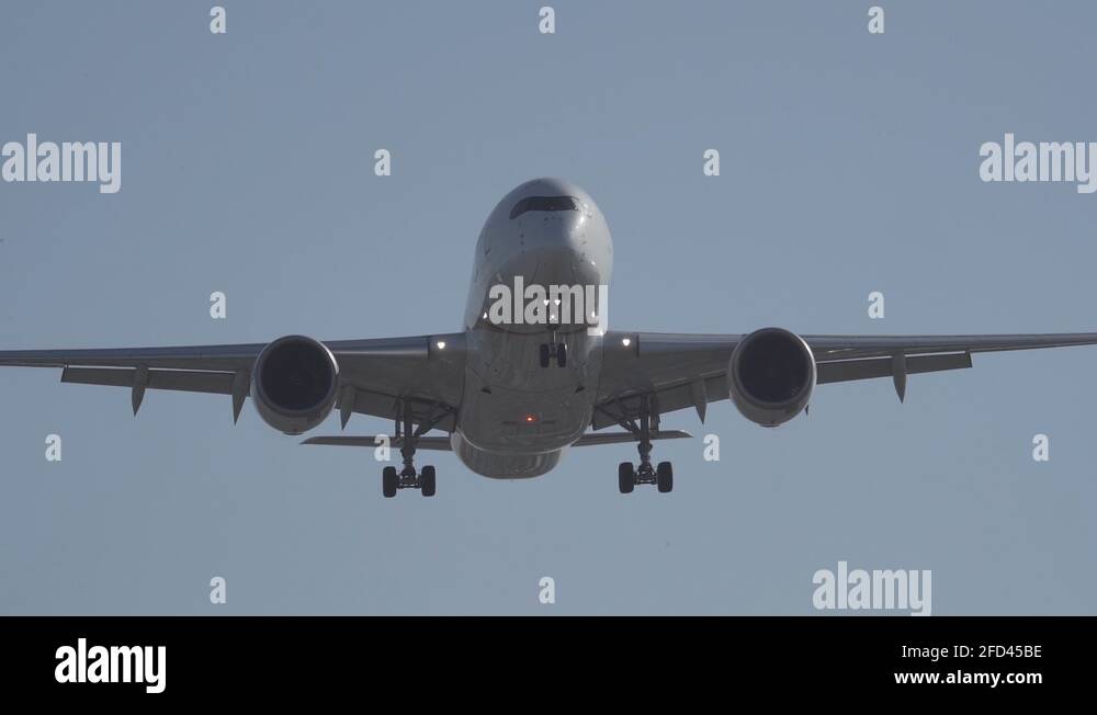 An airliner passes overhead on approach to land at Los Angeles Stock ...