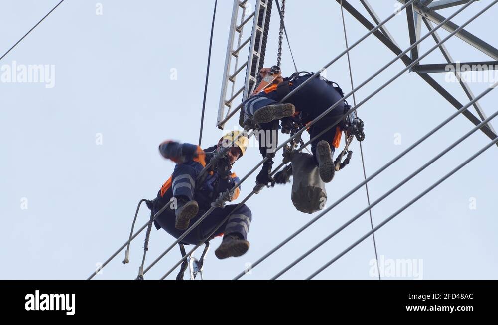 Maintenance work on high voltage power lines Stock Videos & Footage ...
