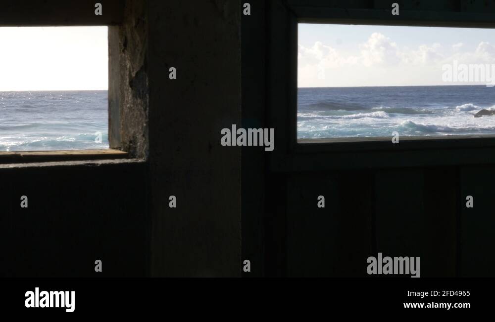 ocean reveal through window slide right past columns at Whittington ...