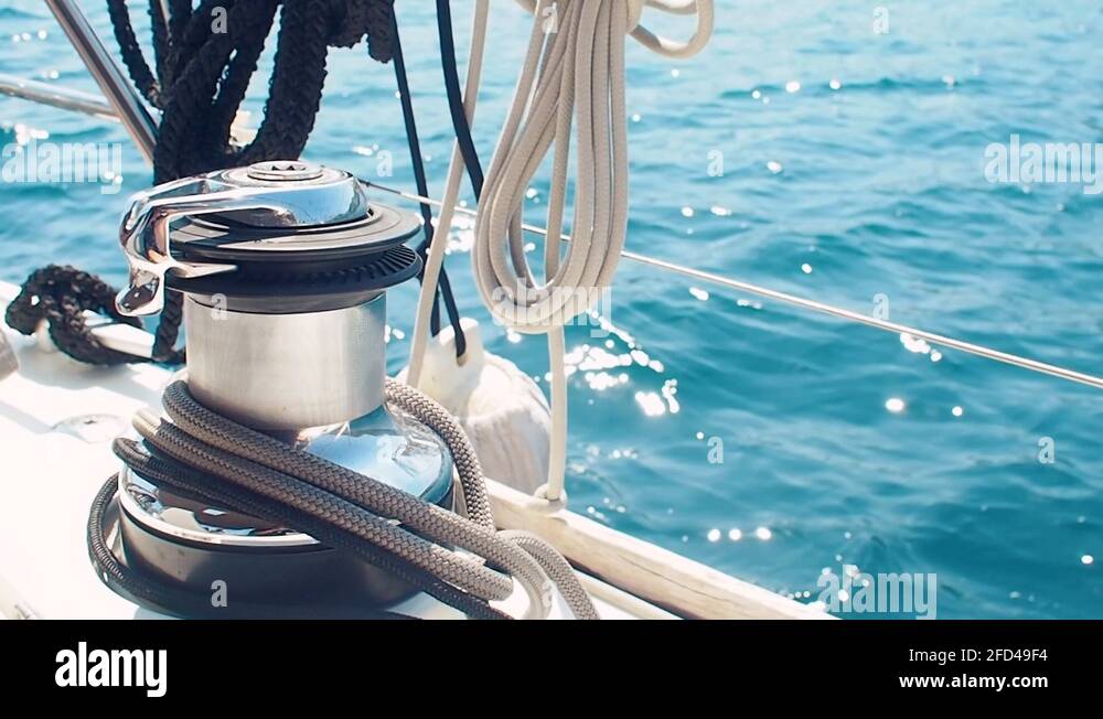 Boat trip on a yacht under sail, a fragment of the deck and a winch ...